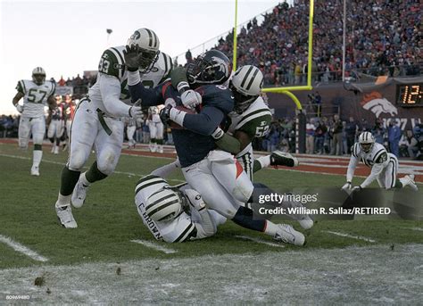 Denver Broncos Tight End Dwayne Carswell Is Corralled By The Jets