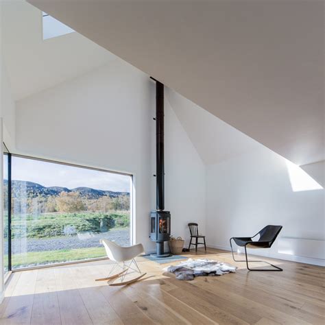 Moxon Adds Red Metal And Larch Extension To Scottish Highlands Farmhouse