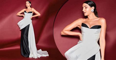 Nora Fatehi Flaunts Her Cleavge In A Sxy Black And White Floor Sweeping