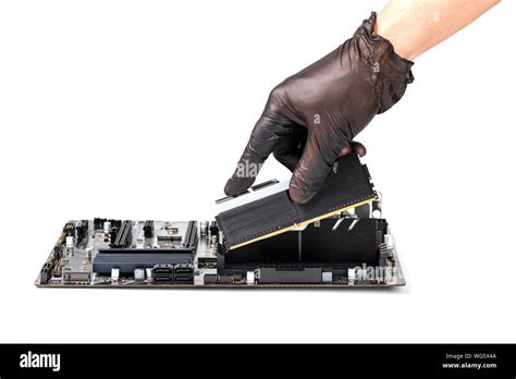 Hand In Black Glove Installing Memory Module With Heatsink In Pc
