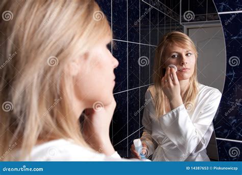 Blond Young Woman In Bathroom Applying Makeup Stock Image Image Of