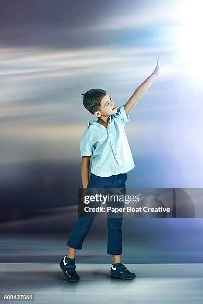 Boy Reaching Up Photos And Premium High Res Pictures Getty Images