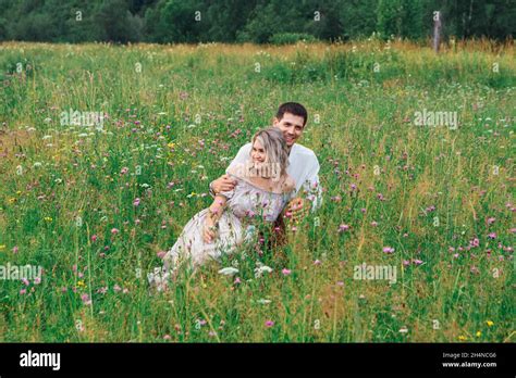 Happy Romantic Inloved Couple Hugging Each Other On A Field Outdoors