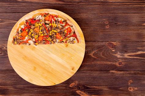 Half A Pizza With Mushrooms Corn Cherry Tomatos Courgettes And Bell