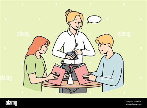 Waitress Takes Order From Young Couple In Restaurant Guy And Girl