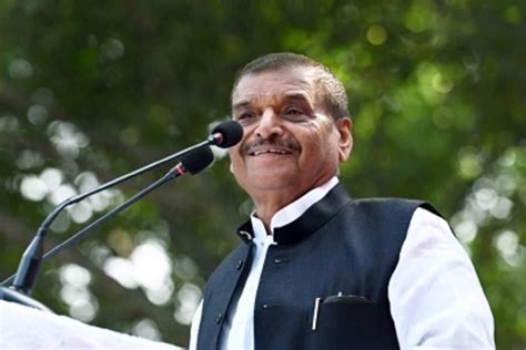 Akhilesh Presents Sp Flag To Pspl Founder Shivpal Singh Yadav