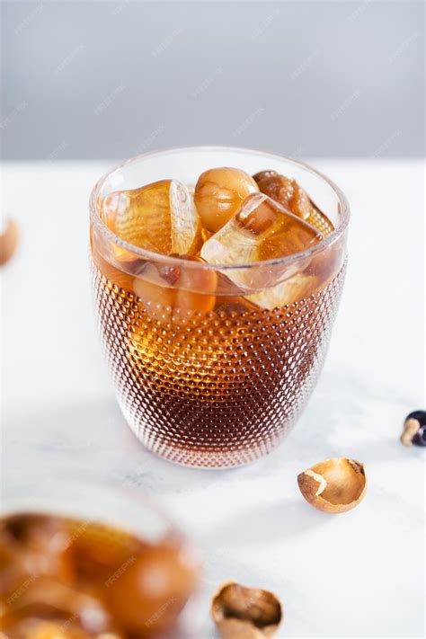 Premium Photo Elicious Cocktail Made Of Longan Juice On Table