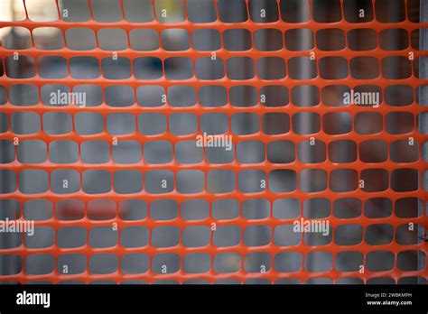 High Visibility Net Work In Progress On A Construction Site Fence Of A Construction Site With