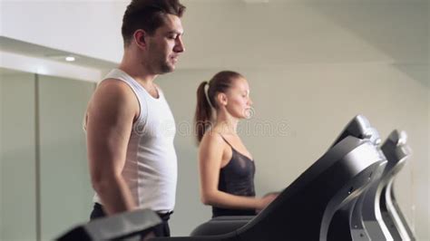 A Man And A Girl Go On The Treadmill Stock Footage Video Of Endurance