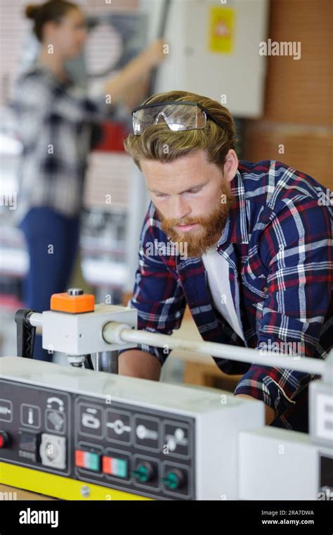 Factory Worker Presses The Buttons Stock Photo Alamy