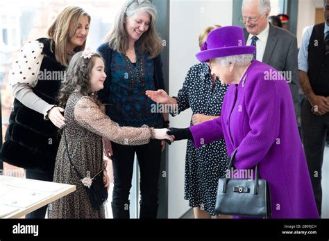 The Queen Meeting Lily Conlan 8 A Cochlear Implant Patient At The Hospital During The Official