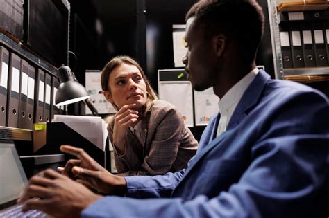 Premium Photo Investigation Team Working Overhours At Fraude Case Analyzing New Evidence In