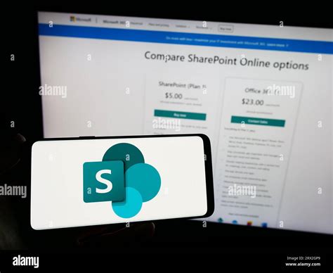 Person Holding Mobile Phone With Logo Of Collaborative Platform