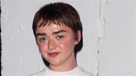Maisie Williams Puts On A Leggy Display In A Textured White Minidress As She Sits Front Row At