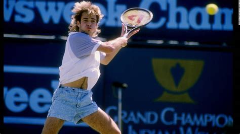 Download Andre Agassi Sporting Iconic Denim Shorts Wallpaper