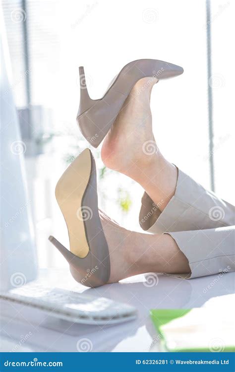 Businesswoman With Her Legs On Her Desk Stock Image Image Of Smiling