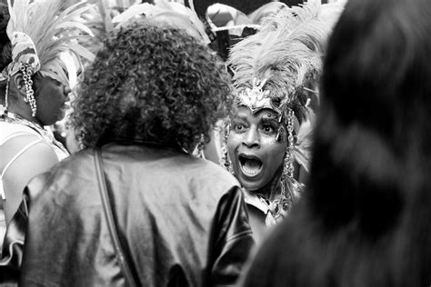People In Costumes With Feathers On The Street At A Parade · Free Stock