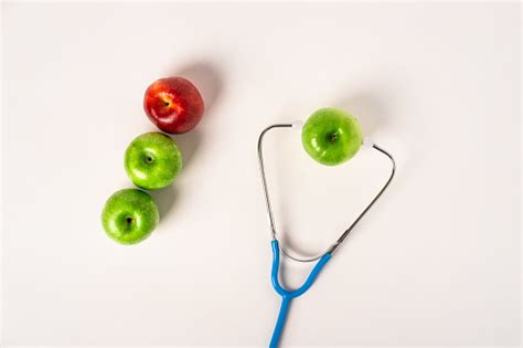 Apples And Stethoscope Medical As A Health Concept White Background