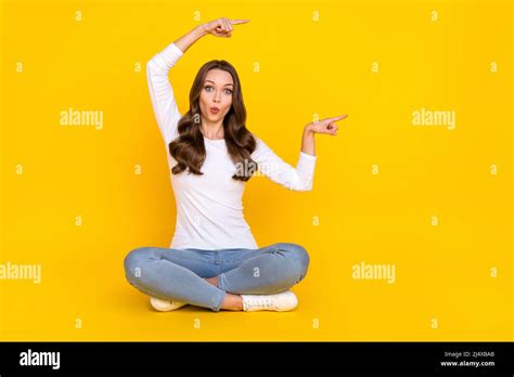 Photo Of Sweet Impressed Woman Wear White Shirt Pointing Empty Space