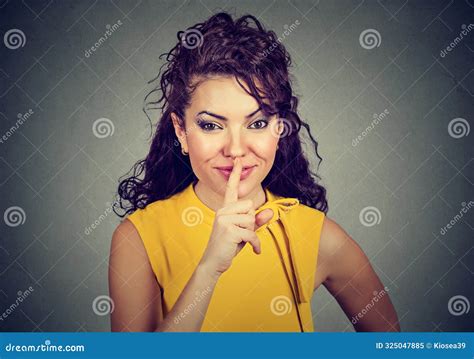 Pretty Woman Asking For A Silence Gesturing With Finger On Lips Stock