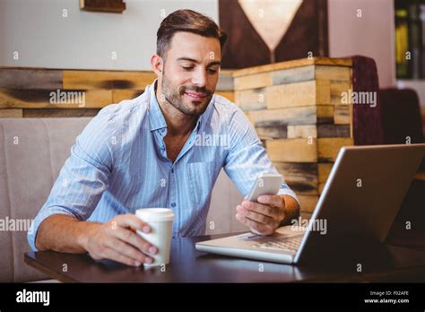 Smiling Businessman Sending A Text Message Stock Photo Alamy
