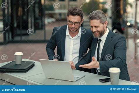 Photo Of Smiling Businessmen Trading Online Two Businessmen Trading