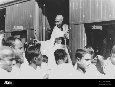 Mahatma Gandhi Alighting From A Third Class Train Compartment At