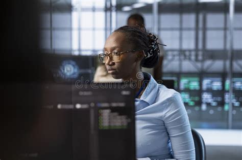 Data Center Employee Conducting Security Audits To Protect Against Cyberthreats Stock Image