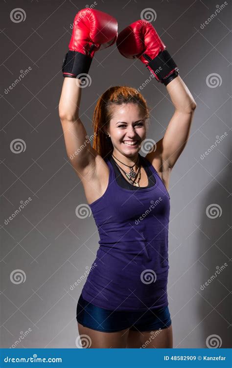 Portrait Of Happy Girl In Boxing Gloves With Raised Hands Stock Image