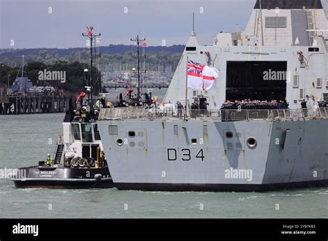 Sailors Line The Deck Of The Destroyer Hms Diamond On Its Return From A