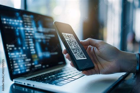 scanning qr code for multi factor authentication on laptop screen concept of digital security