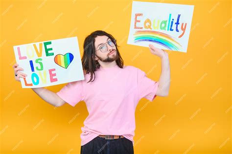 Premium Photo Hands Of Gay Man Holding Lgbt Banner On Rainbow Flag
