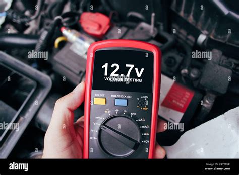 Car Battery Voltage Testing With A Digital Multimeter By Auto Technician Car Voltage Current