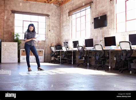 Female Designer Planning Layout On Floor Of Modern Office Stock Photo Alamy