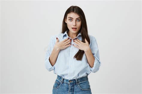 Indoor Portrait Of Attractive Cute Girl With Long Hair Expressing