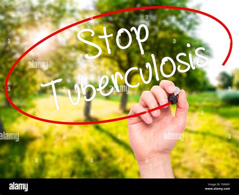 Man Hand Writing Stop Tuberculosis With Black Marker On Visual Screen