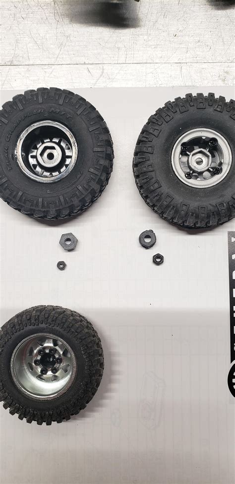 Top Left Is Scx24 Machete Wheel With Scx24 Hub And Wheel Nut Below It