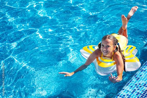 Preteen Girl Dressed Red Swimsuit Swimming In The Blue Resort Pool On