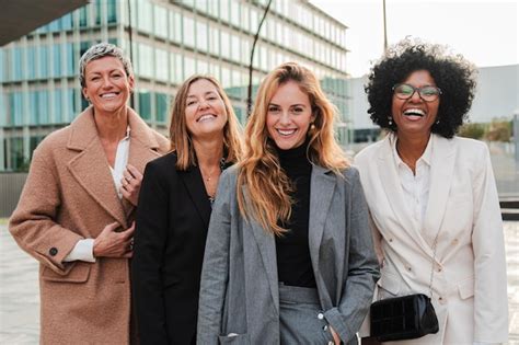 Premium Photo Group Of Proud Businesswomen Smiling And Looking At