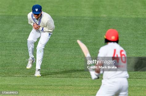 Ben Manenti Of The Redbacks Is Caught By Chris Green Of The Blues