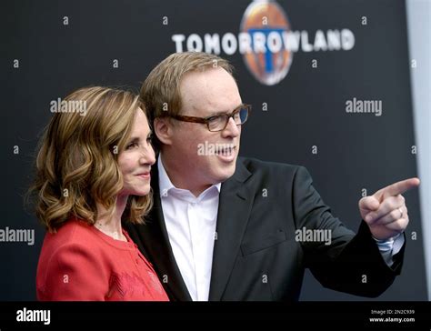 Elizabeth Canney Left And Director Brad Bird Arrive At The World Premiere Of Tomorrowland At