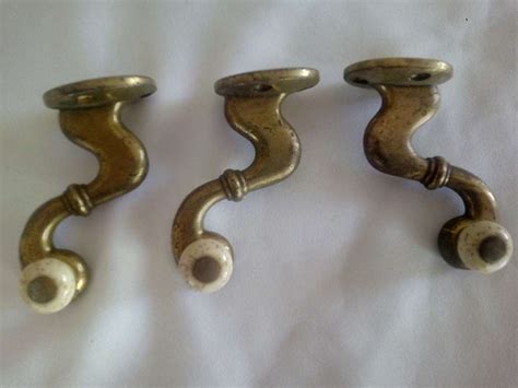 Brass Set Of 3 Vintage Brass Porcelain Coat Hooks Was Sold For 245 00