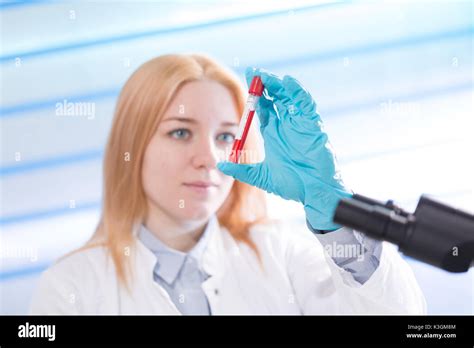 Doctor Woman Working A Microscope Female Scientist Looking Through A