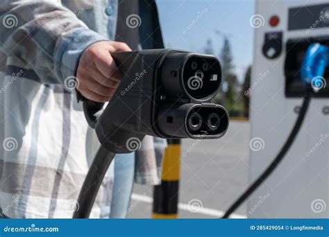 Woman Holding Ccs Fast Charging Socket Type 2 Plug For Electric