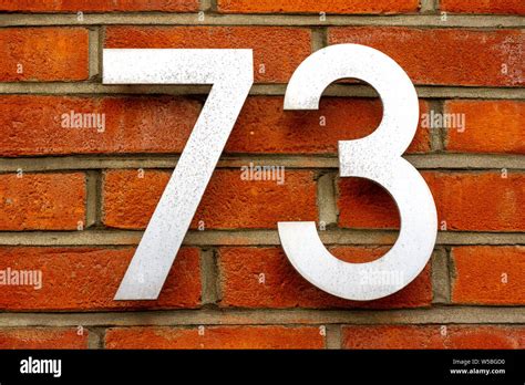 House Number 73 On A Red Brick Wall Stock Photo Alamy