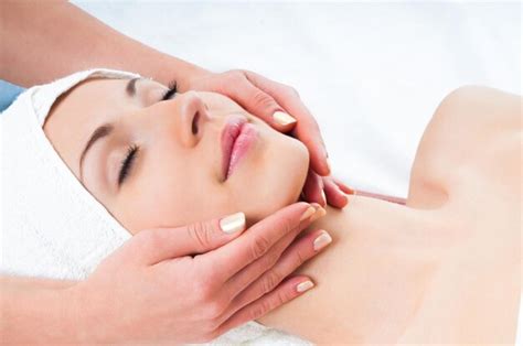 Premium Photo Beautiful Young Woman Enjoying Facial Massage In Spa