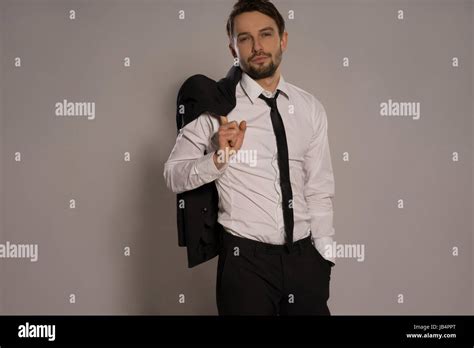 Handsome Young Businessman With His Jacket Thrown Over His Shoulder