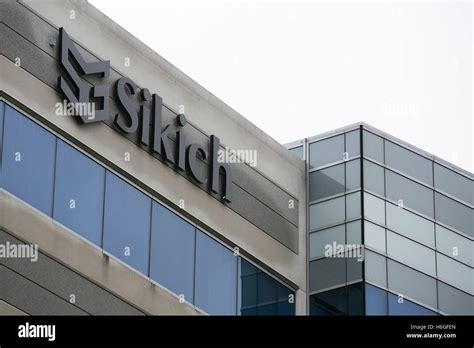 A Logo Sign Outside Of The Headquarters Of Sikich LLP In Naperville