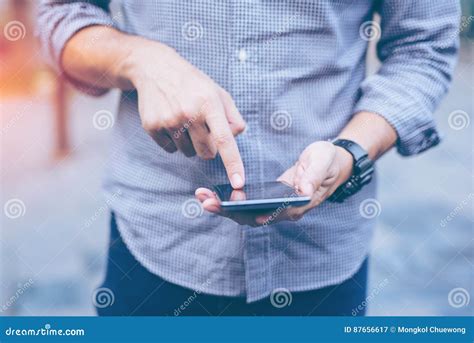 Hand Of Businessman Using While Reading His Smartphone Stock Image