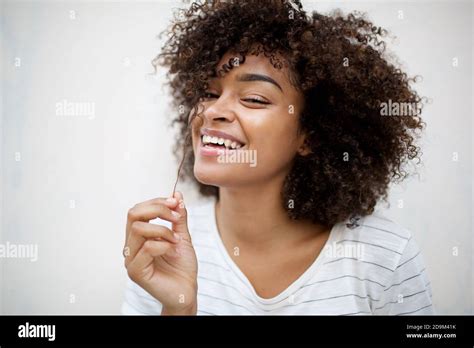 Close Up Portrait Smiling Young African American Woman Pulling Curly